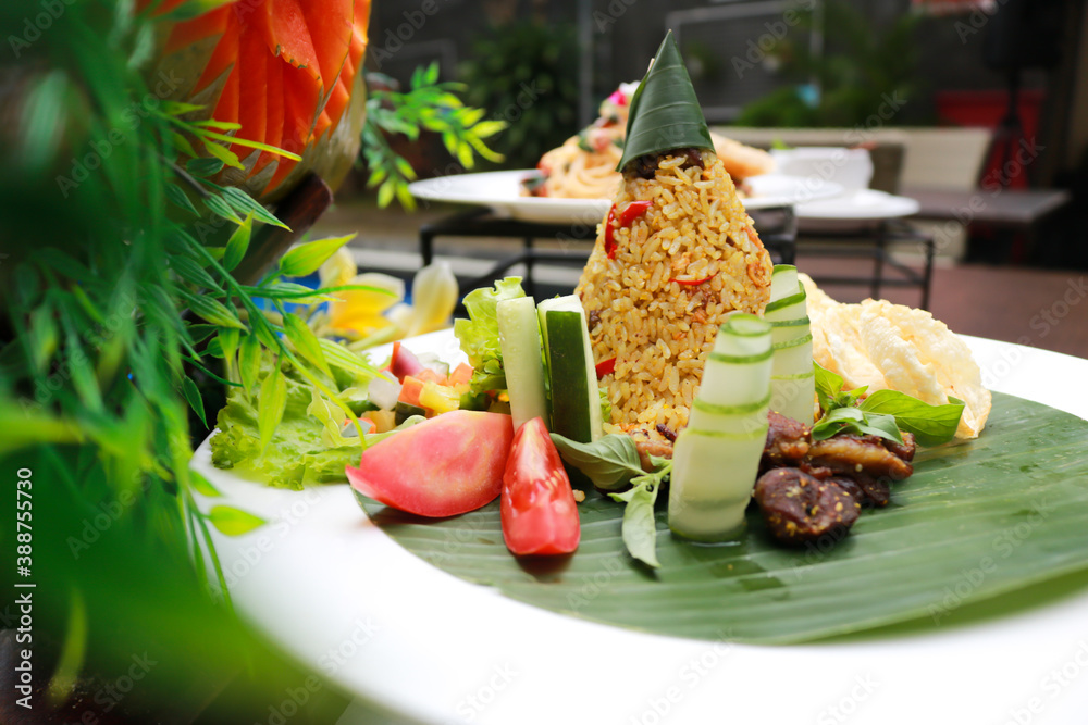 Traditional Indonesian Cuisine Nasi Tumpeng. Tumpeng is a cone-shaped ...