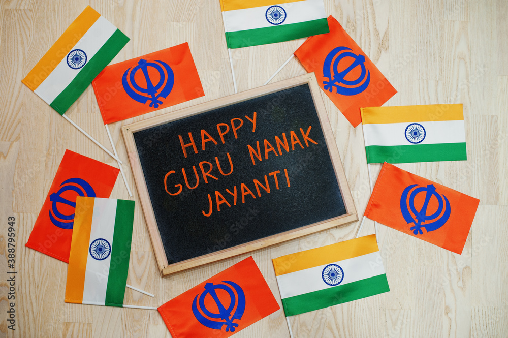 Happy Guru Nanak Jayanti theme. Board with flags. Stock Photo | Adobe Stock