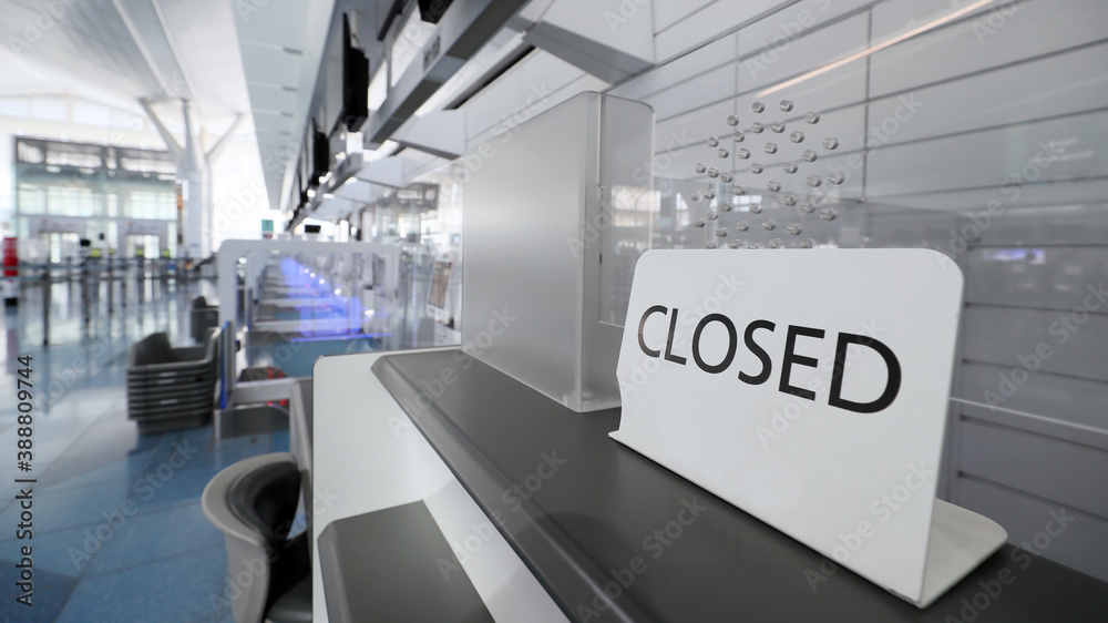 Closed and empty departure check-in counter in International airport ...