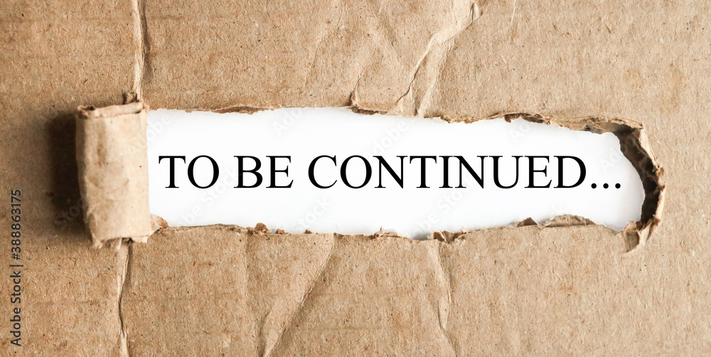 to be continued, text on white paper on torn paper background Stock ...
