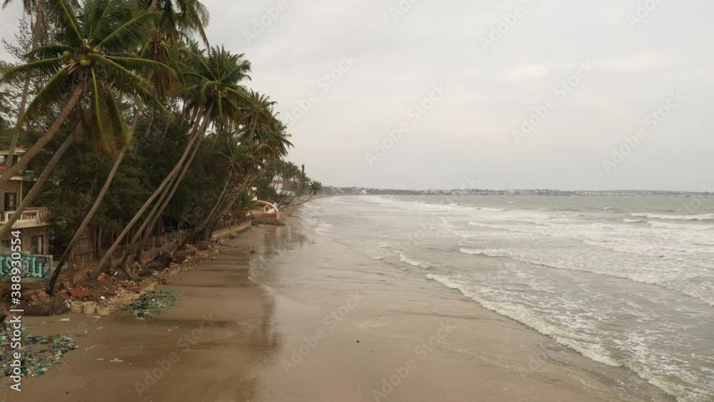 Paradise coconut palm trees sea beach all dirty with plastic trash ...