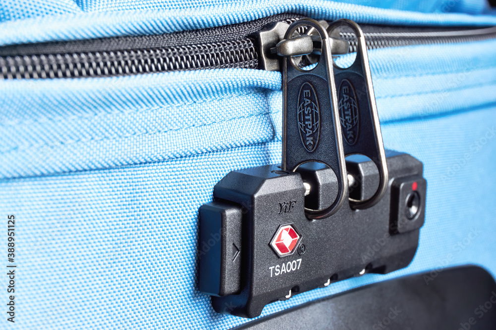 Foto de TSA accepted lock on a trolley suitcase with the red Travel ...