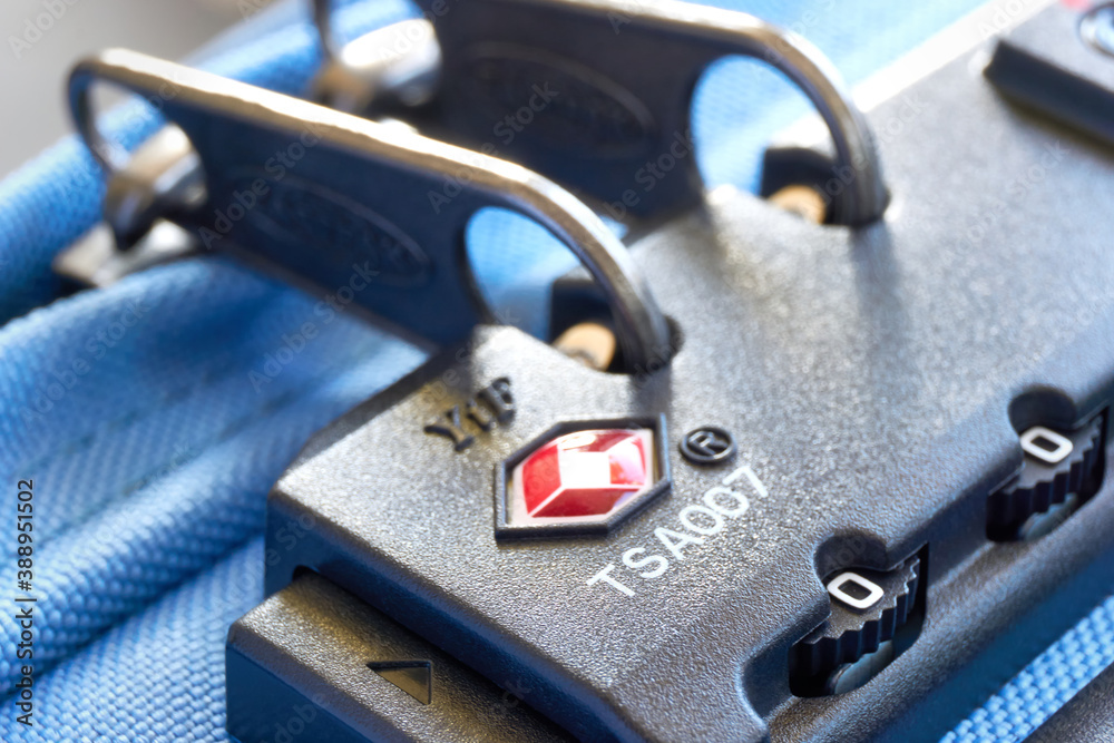 TSA accepted lock on a trolley suitcase with the red Travel Sentry logo ...