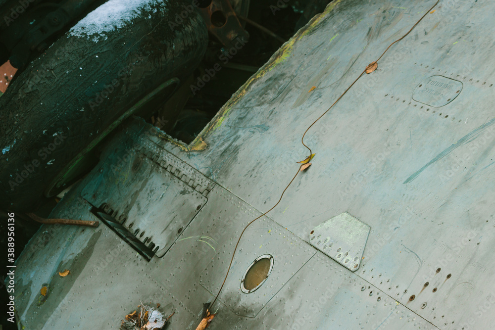 Plane wreckage, wing parts and a wheel of a burned and broken plane at ...