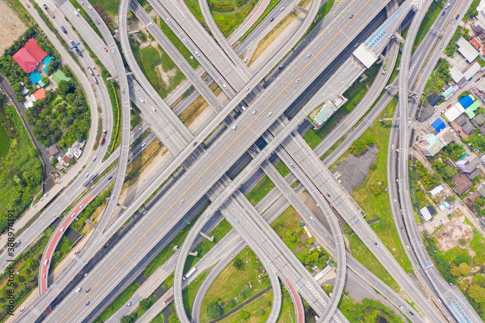 Aerial view of cars driving on highway junctions. Bridge street roads ...