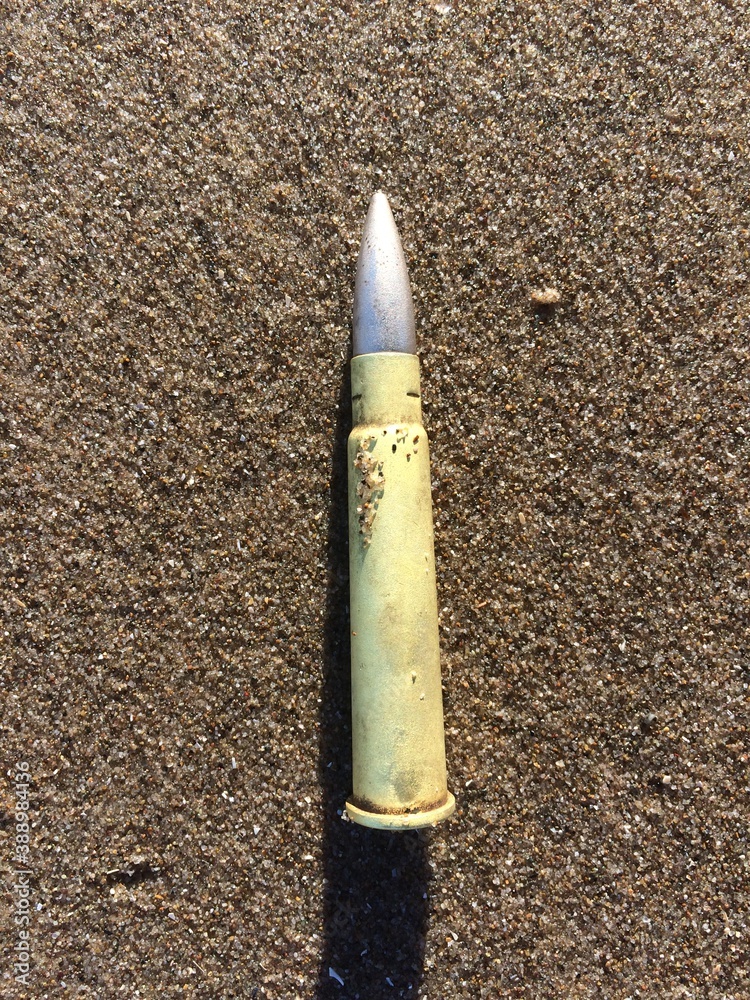 A live 1941 world war 2 machine gun bullet found on a beach in england ...