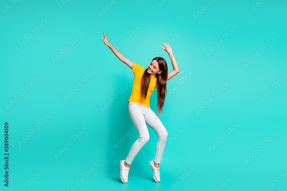 Full size photo of cool positive kid girl dancing isolated over teal ...