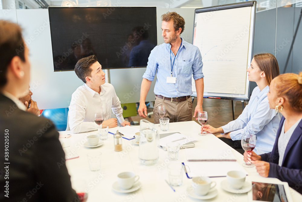 Team with consultant in a coaching workshop Stock Photo | Adobe Stock