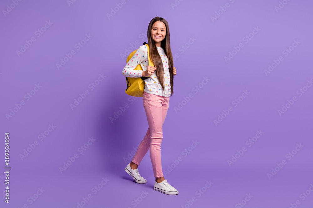 Full length body size photo of preteen girl with long hair carrying ...