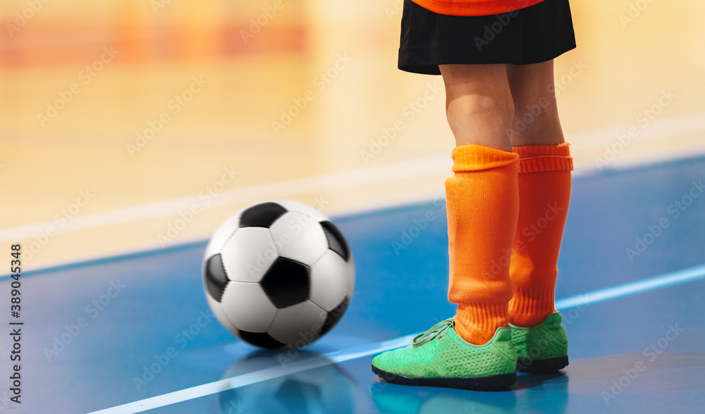 Indoor football player with classic ball. Futsal training for children ...