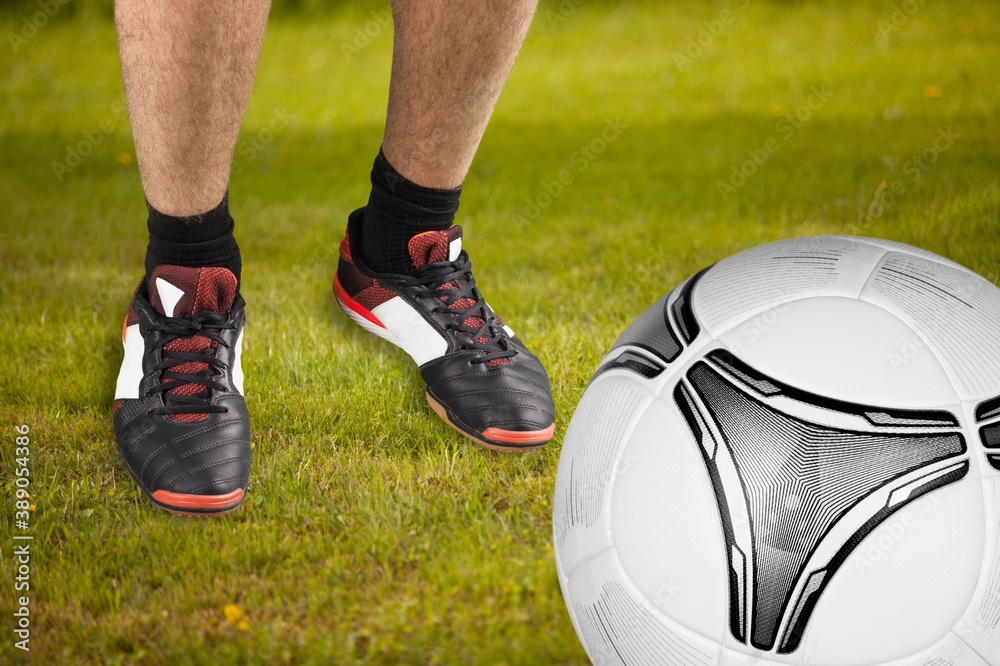 Soccer football ball and sportsman legs Stock Photo | Adobe Stock