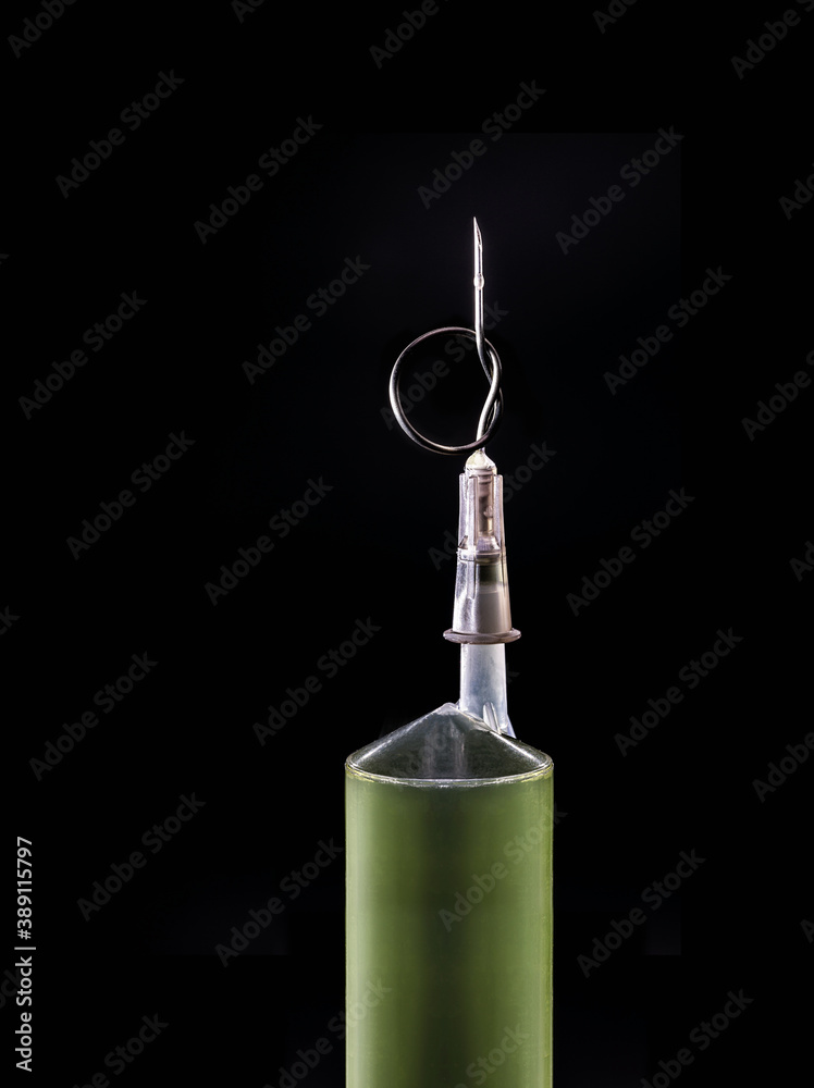 syringe or injection with a knot in the needle, conceptual image about ...