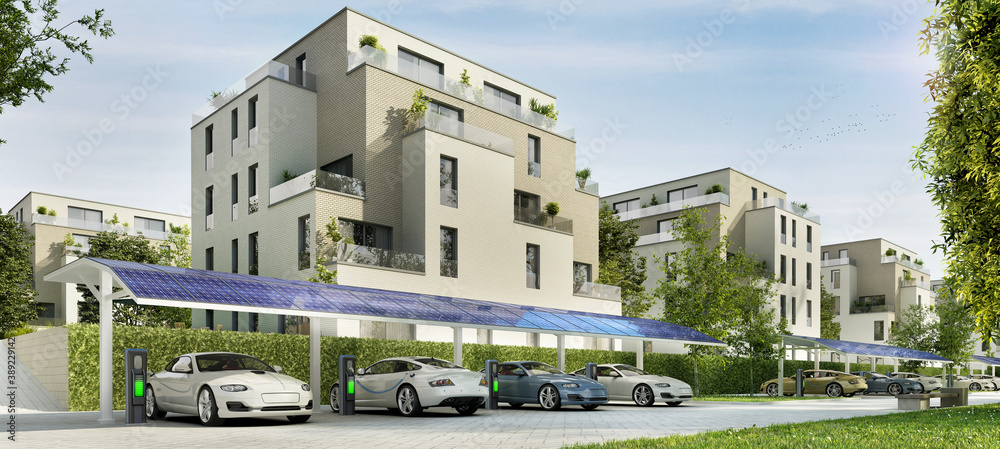 Street with modern residential buildings and parking for electric cars ...