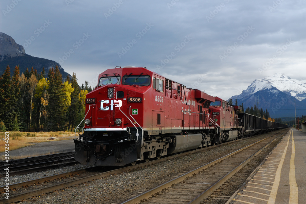 Red freight train at Banff station Alberta Banff, Canada - October 9 ...
