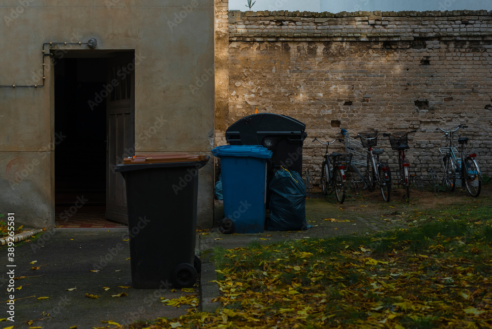 Garbage place in a backyard, garbage cans in a Berlin backyard Stock ...