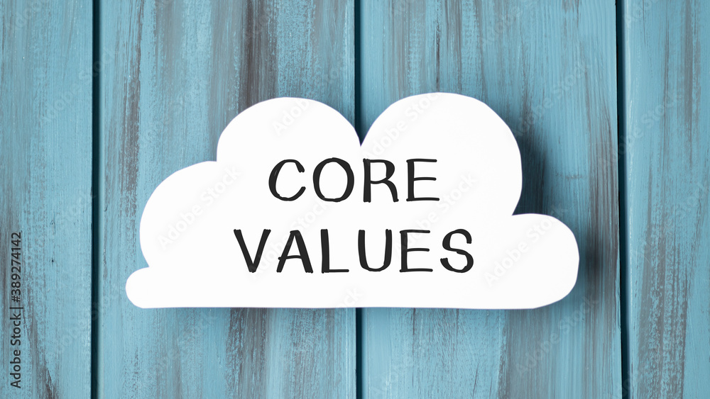 White card in cloud shape with text Core Values on stylish wooden ...