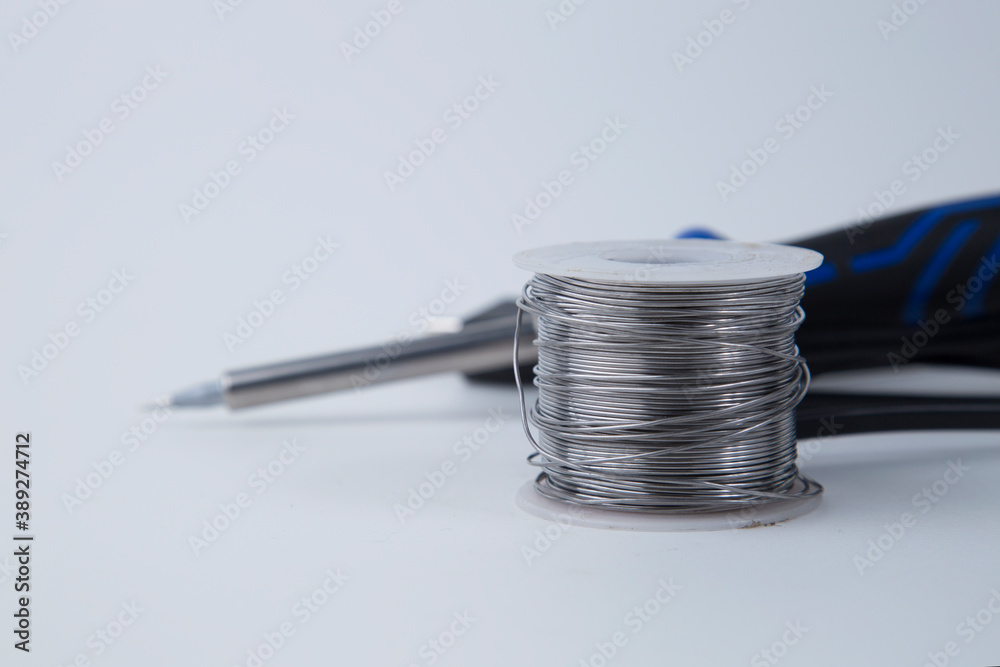 Solder for soldering with a soldering iron in a Bay on a white ...