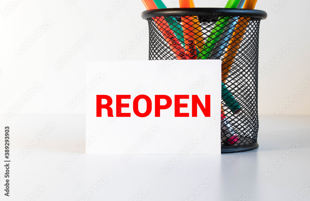 Reopening concept after the coronavirus pandemic. REOPEN word on a ...