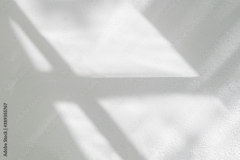 Abstract light reflection and grey shadow from window on white wall ...