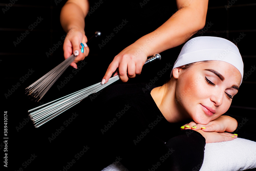 Taoist massage with metal brooms. Iron broom for stuffing. Thai massage ...