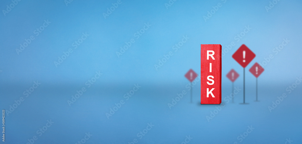 Risk text on wooden red block with risk icon at background. Risk ...