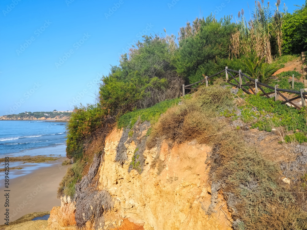 Hiking at the beach of Praia Maria Luisa, Olhos da Agua, Albufeira, at ...