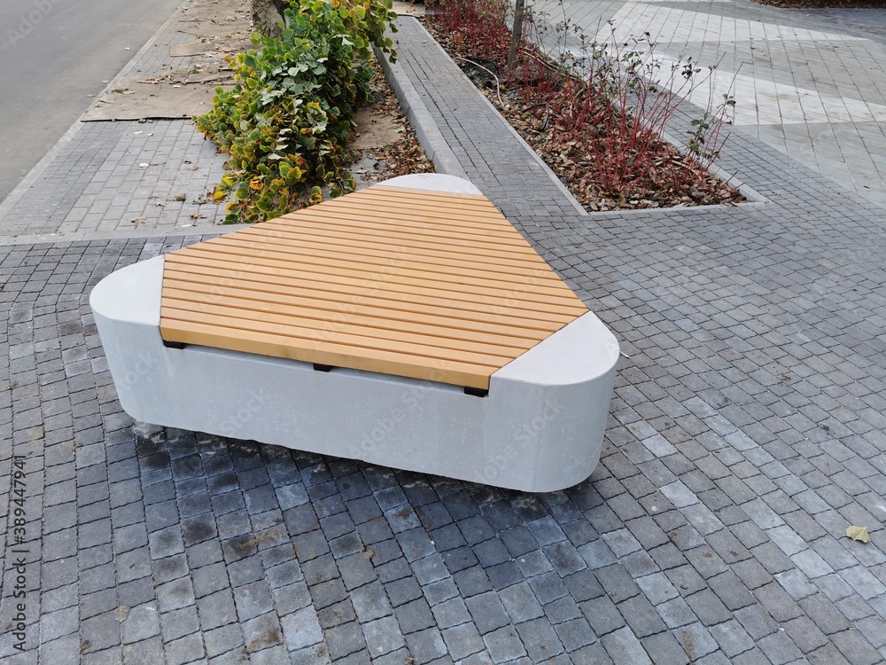 triangular wooden bench in the park Stock Photo | Adobe Stock