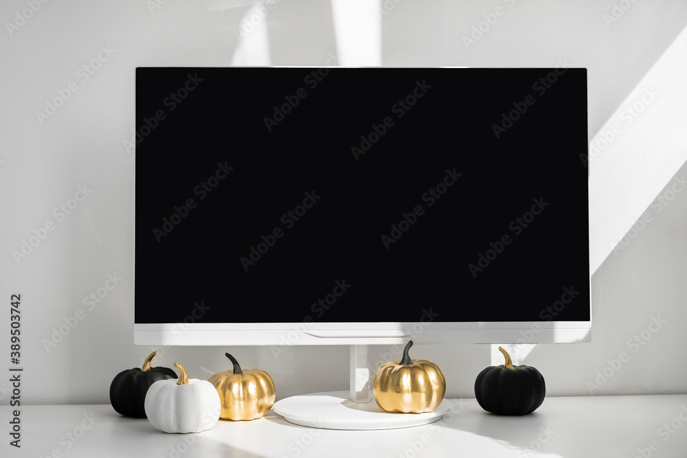 Blank screen desktop computer in modern minimal office room with autumn ...