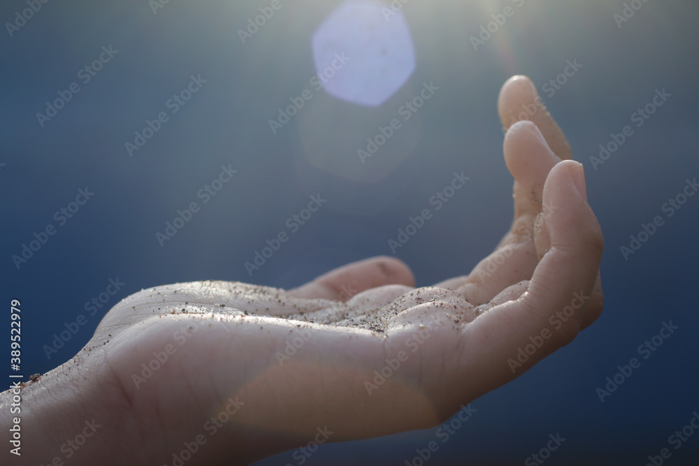 Hand gesture receiving the light of blessings in spiritual concept on ...