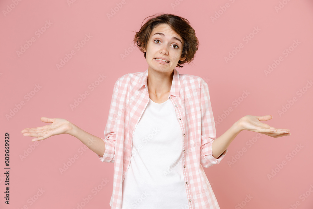 Confused puzzled unconfident young brunette woman 20s wearing casual ...