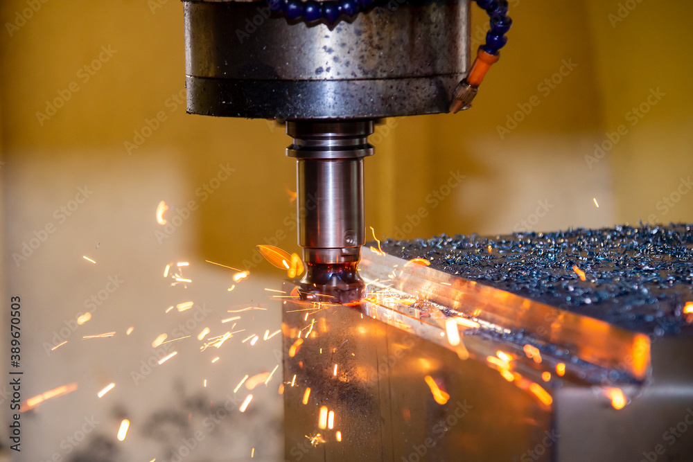 The burning chip from CNC milling machine rough cutting by index-able ...
