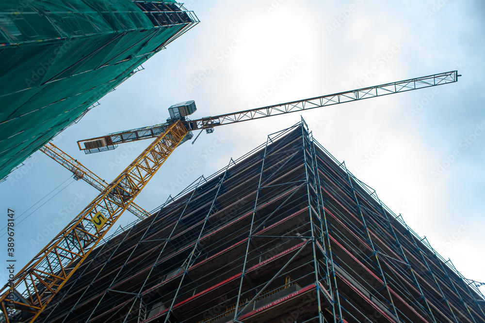Construction site jib crane. Construction of new modern buildings ...