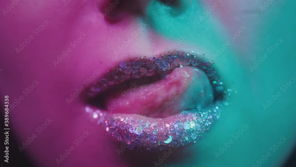 Female lips in neon ultraviolet light. Fashionable neon light, euphoria ...