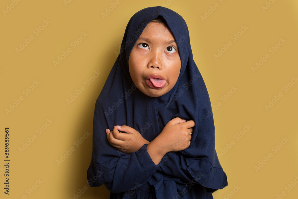 asian little muslim girl wearing hijab with weird expression Stock ...