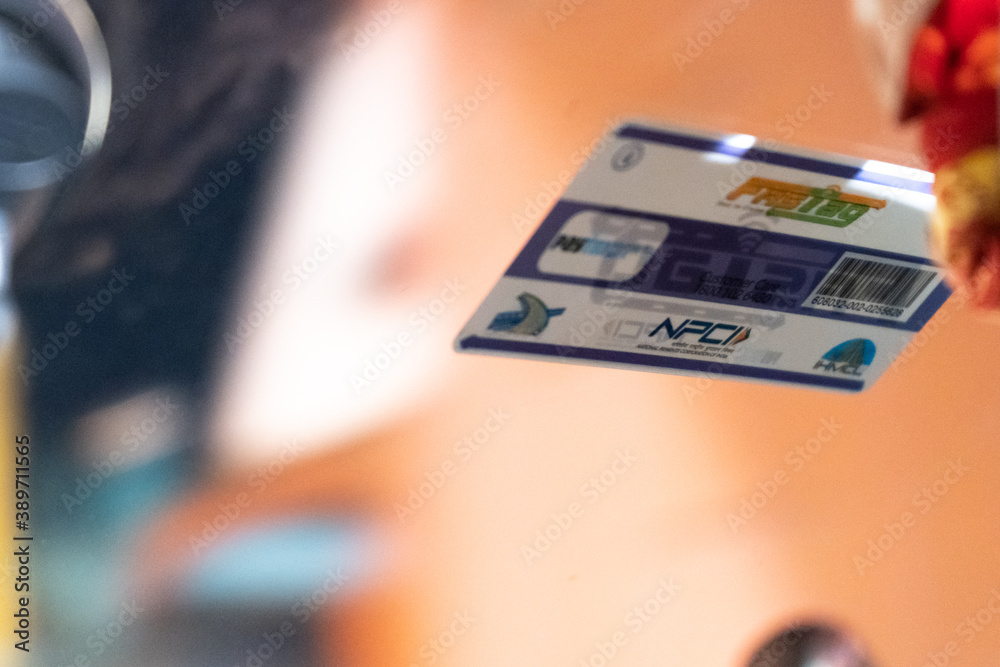 Fastag RFID stickers placed on a windsheild in India with bokeh ...