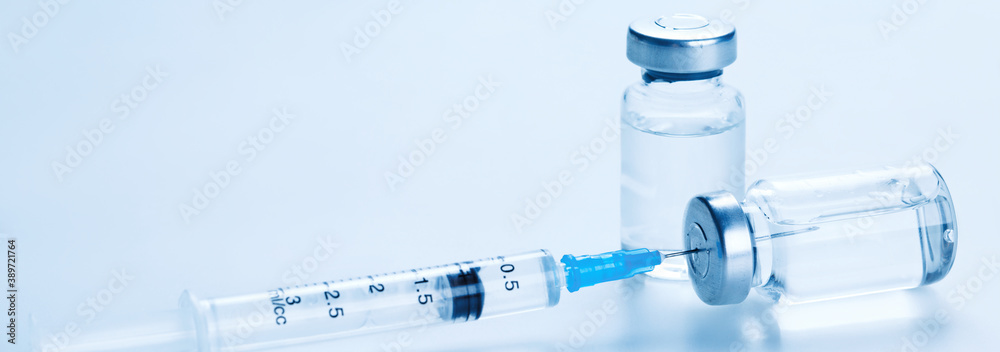 Medical syringe with a needle and a bollte with vaccine. Stock Photo ...