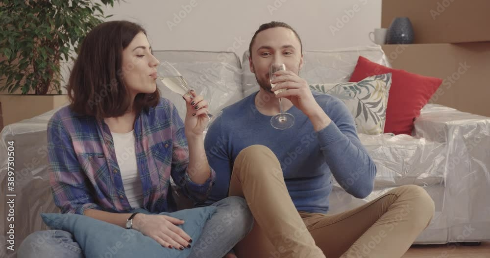 Beautiful young woman and caucasian man knocking over glasses of ...