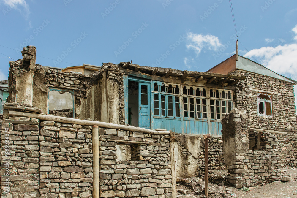 Typical stone houses in a Caucasian village. Poor village in Azerbaijan ...