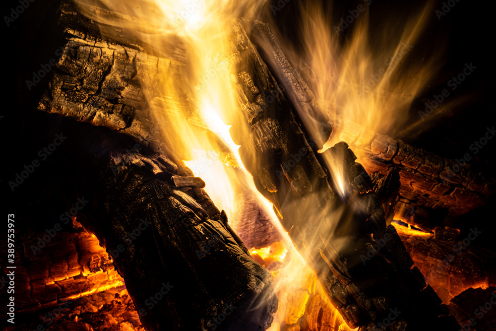 whispy flames wood burning in a fire pit Stock Photo | Adobe Stock