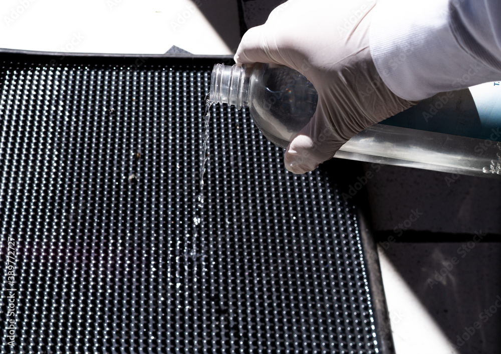 man, gloved man, disinfectant, disinfectant carpet, disinfectant liquid ...