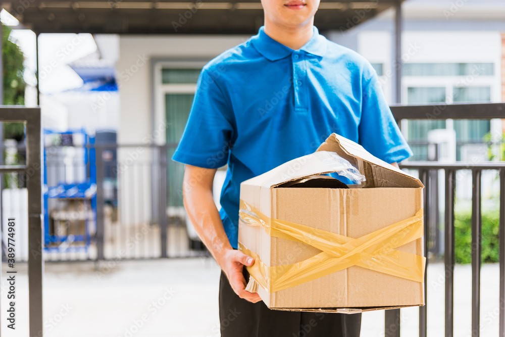 Asian young delivery man in blue uniform he emotional falling courier ...