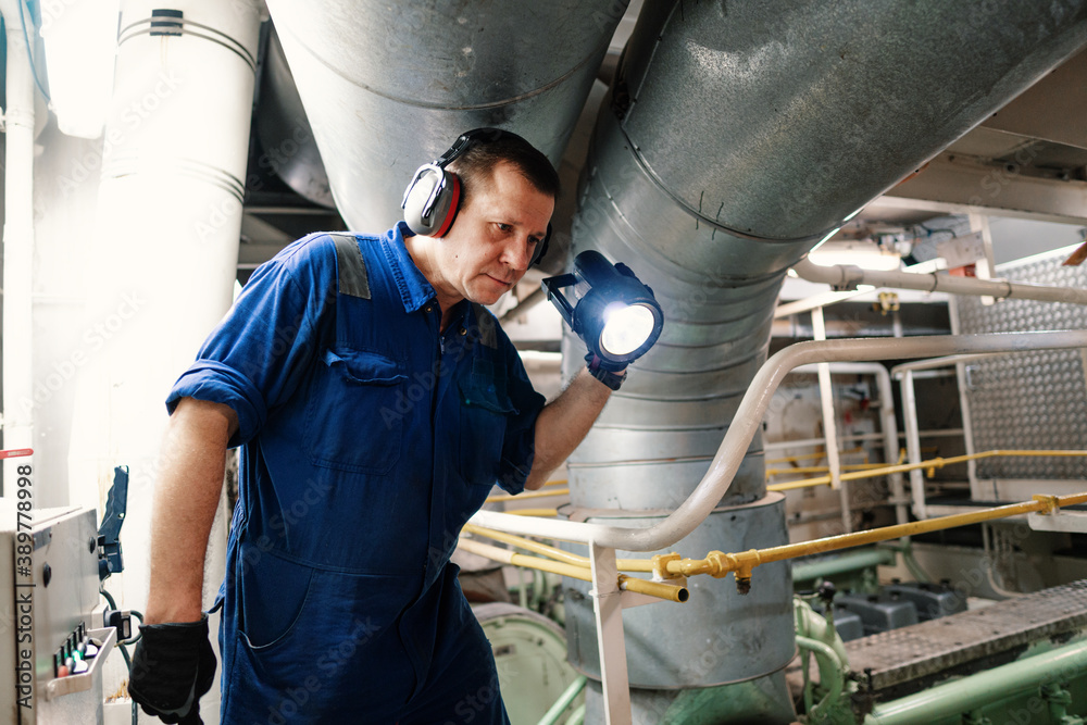Marine engineer officer controlling vessel enginesand propulsion in ...