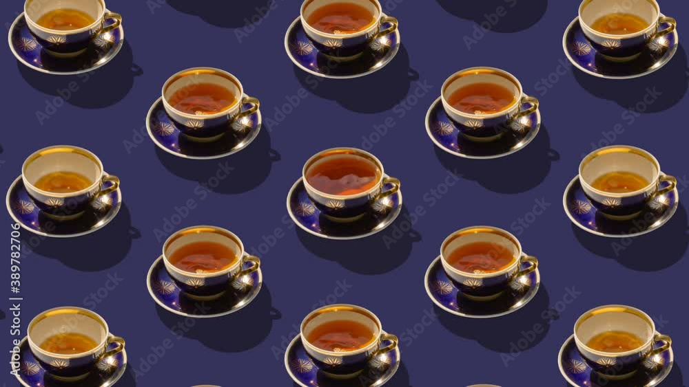Background from large group of cups with tea. Ceramic cups rotate and ...