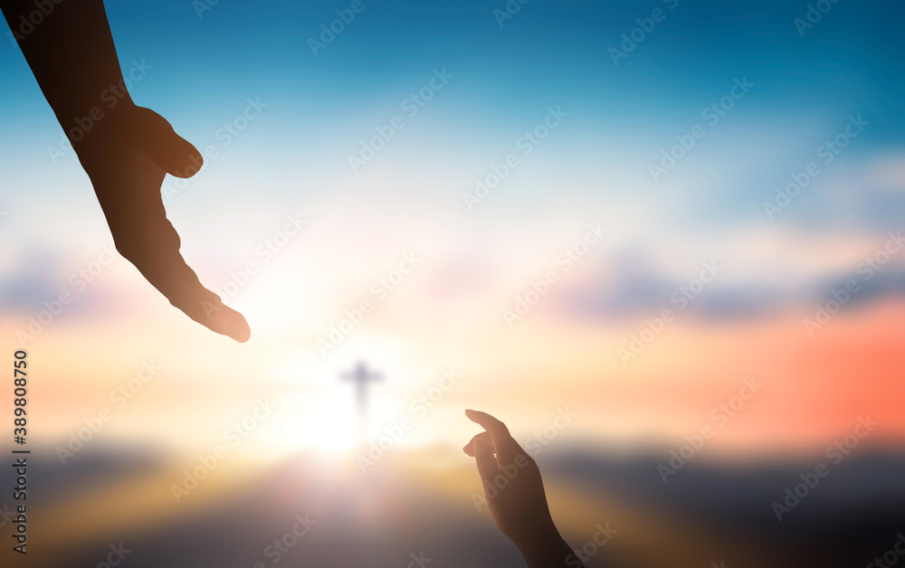 Help hand of God reaching over blurred cross on sunrise background ...