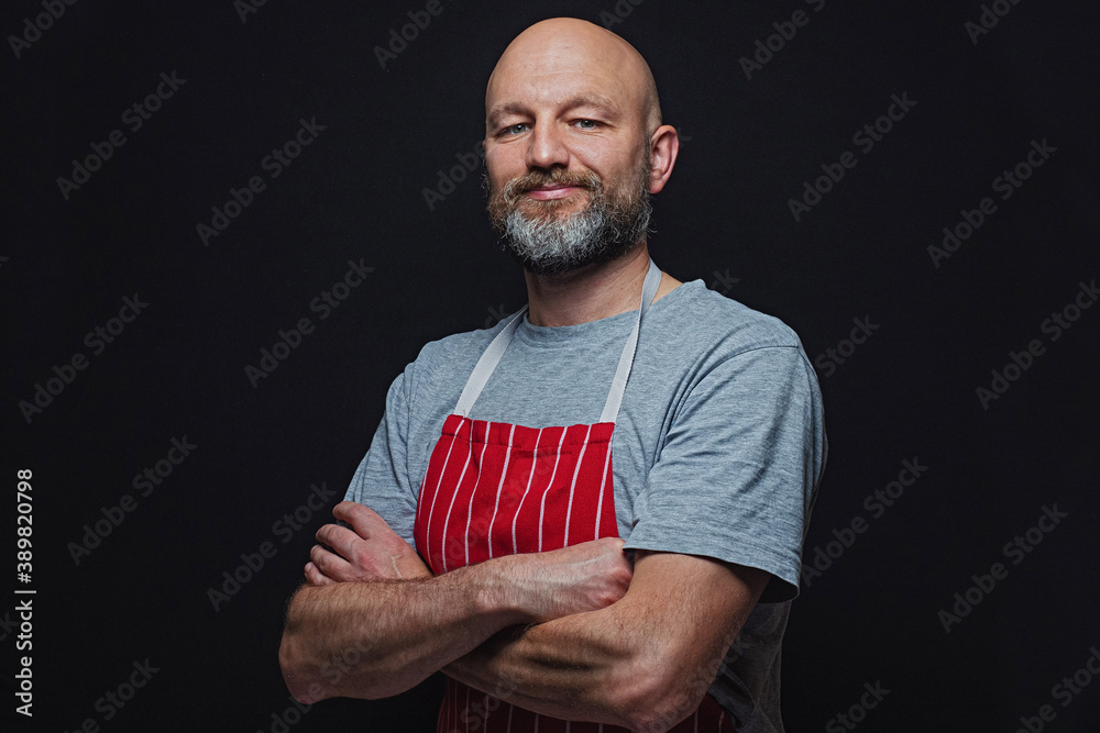 Professional fishmonger or butcher in grey t-shirt and red and white ...