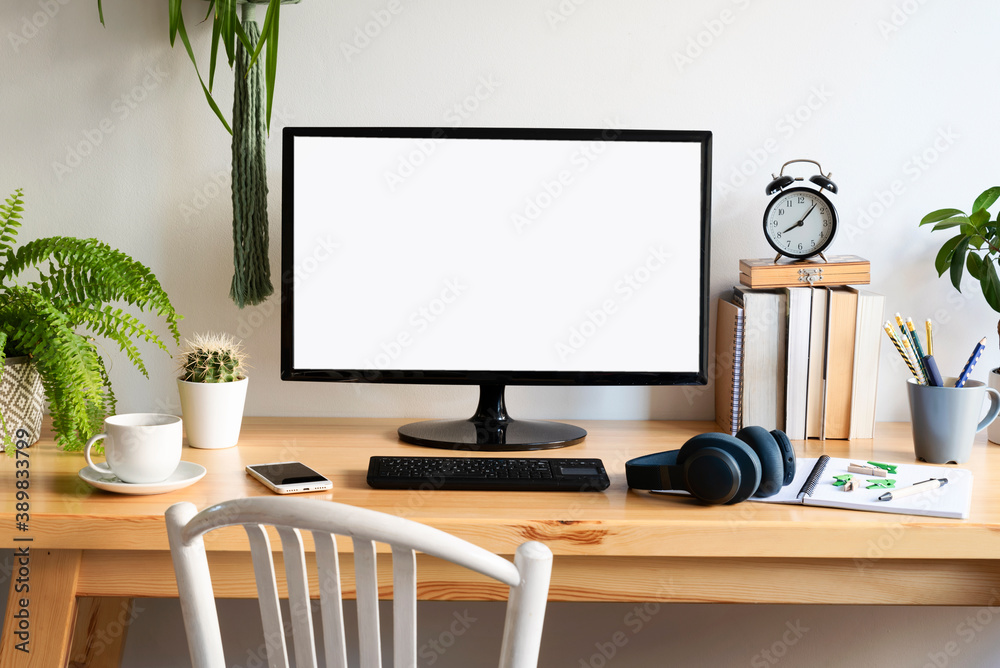 Modern office desk with blank monitor screen of computer on wooden ...