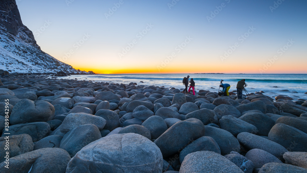 Group of landscape photographers at the famous beach near Uttakleiv ...