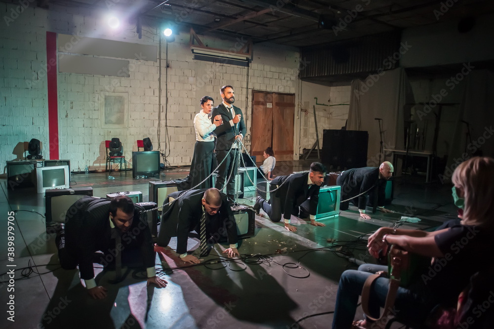 Large group of theater actor artists on stage perform play for audience ...