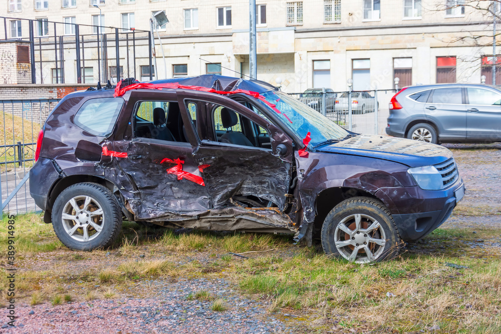 Wrecked crumpled car from the right side after a severe accident with a ...
