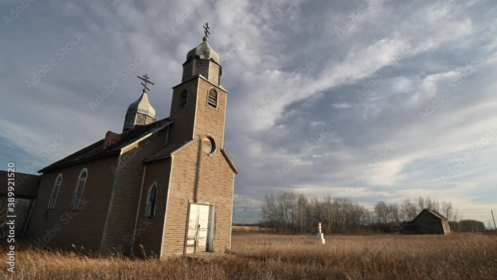 Looking up an old abandoned modest church with faux brick siding and ...